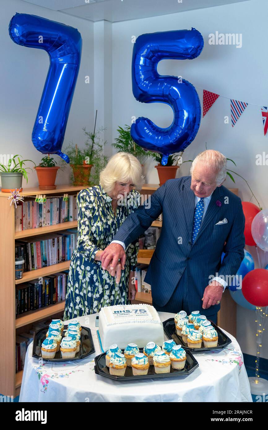 Britain's King Charles III and Queen Camilla cut a commemorative cake ...