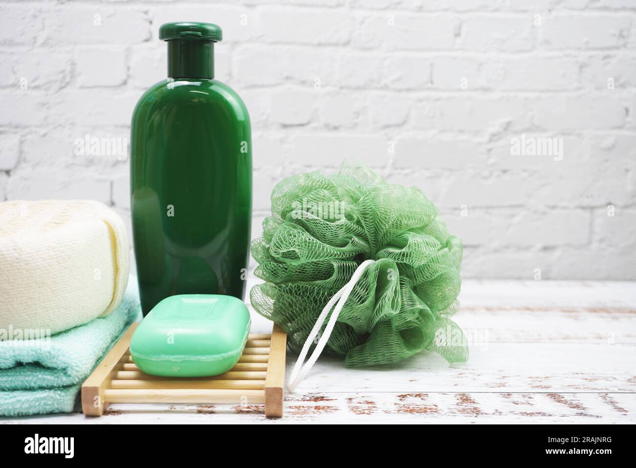 Shower Bottle and Shower Puff Fibre Scrub Stock Photo - Alamy