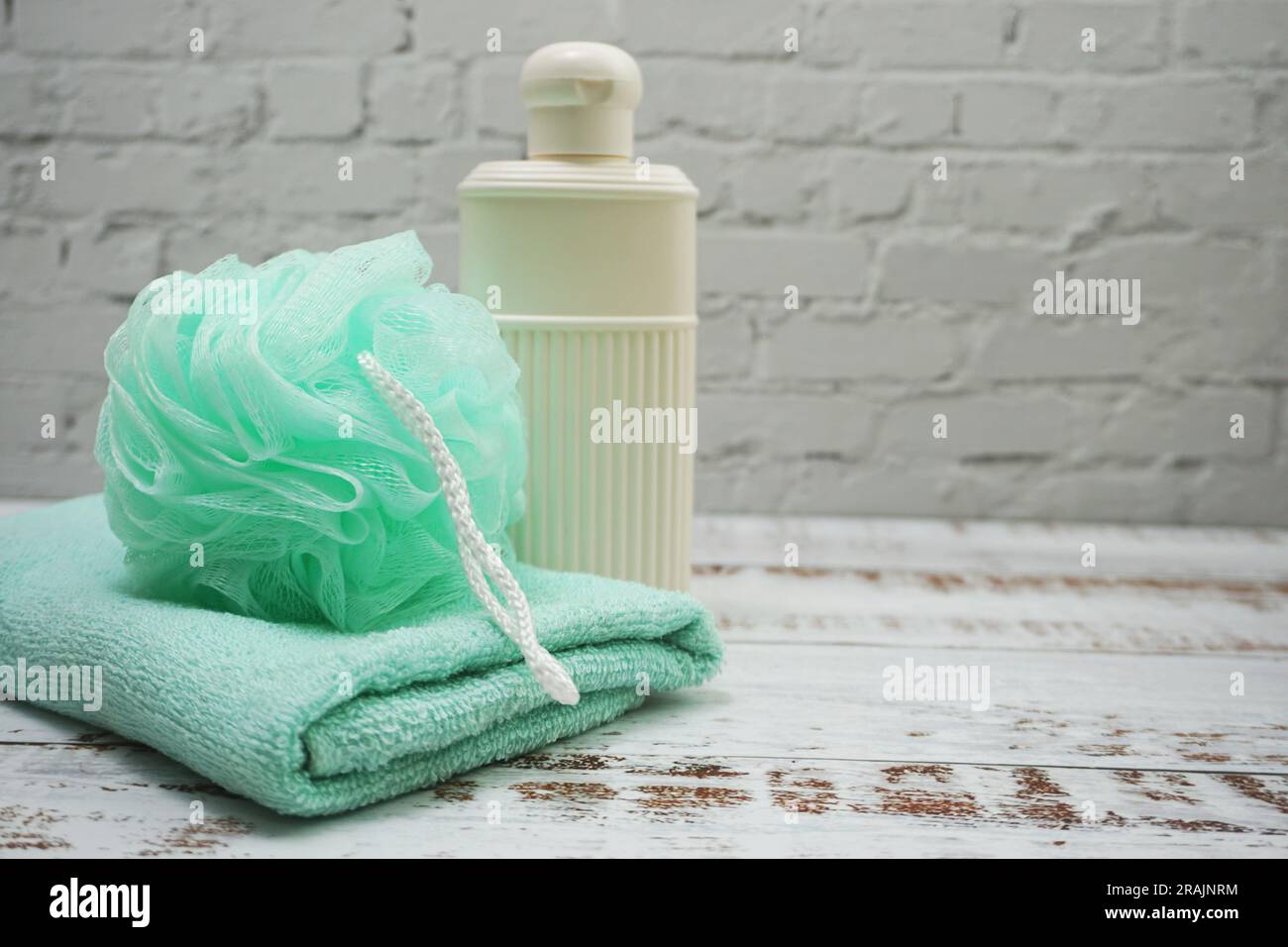 Shower Bottle and Shower Puff Fibre Scrub Stock Photo - Alamy