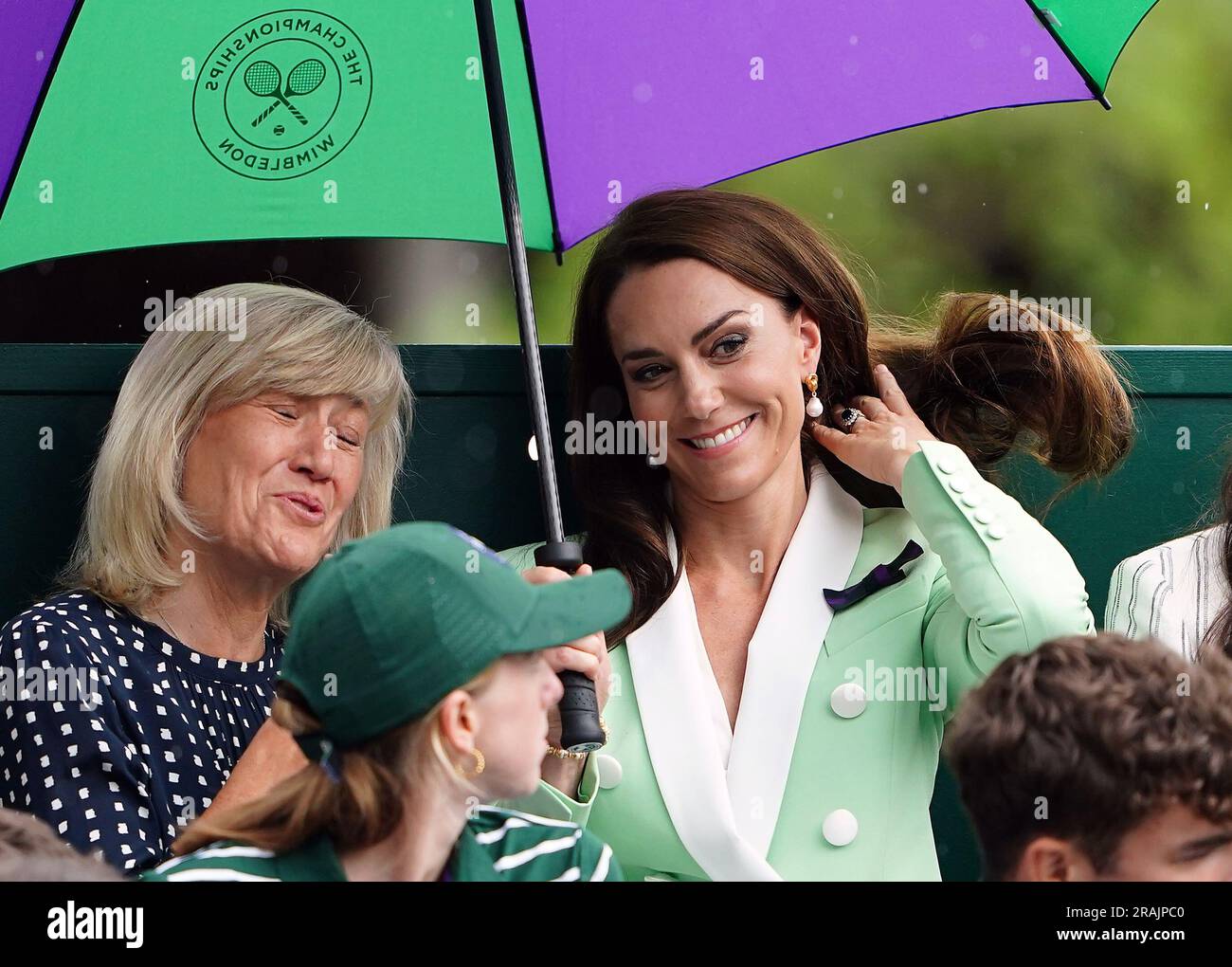 The Princess of Wales under an umbrella with Deborah Jevans before rain ...