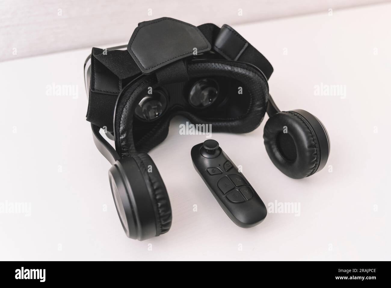 Close-up of Joysticks and VR glasses on white background. Virtual ...