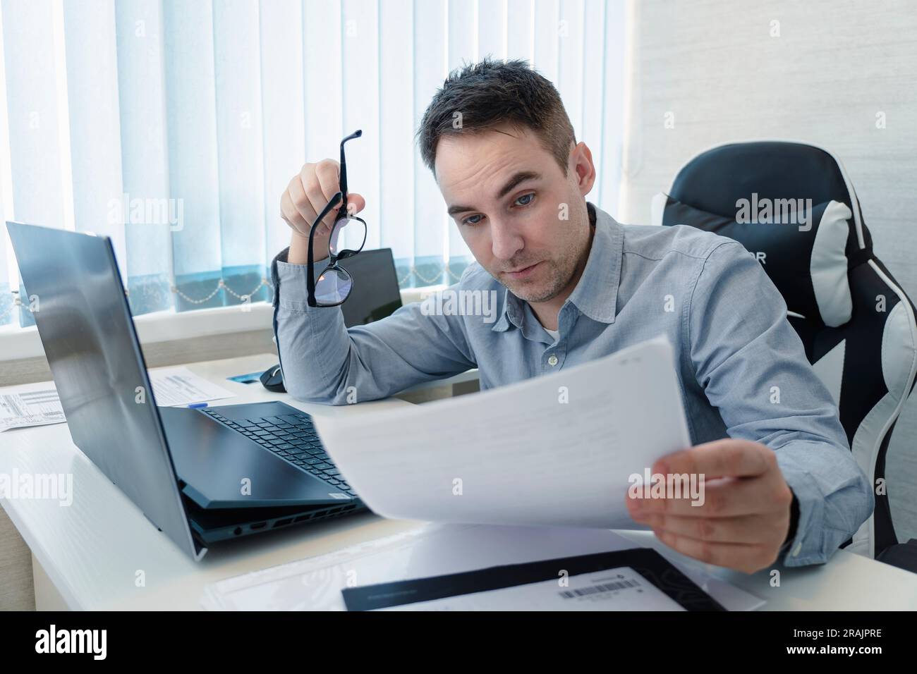 Young man look at the graph hi-res stock photography and images - Alamy