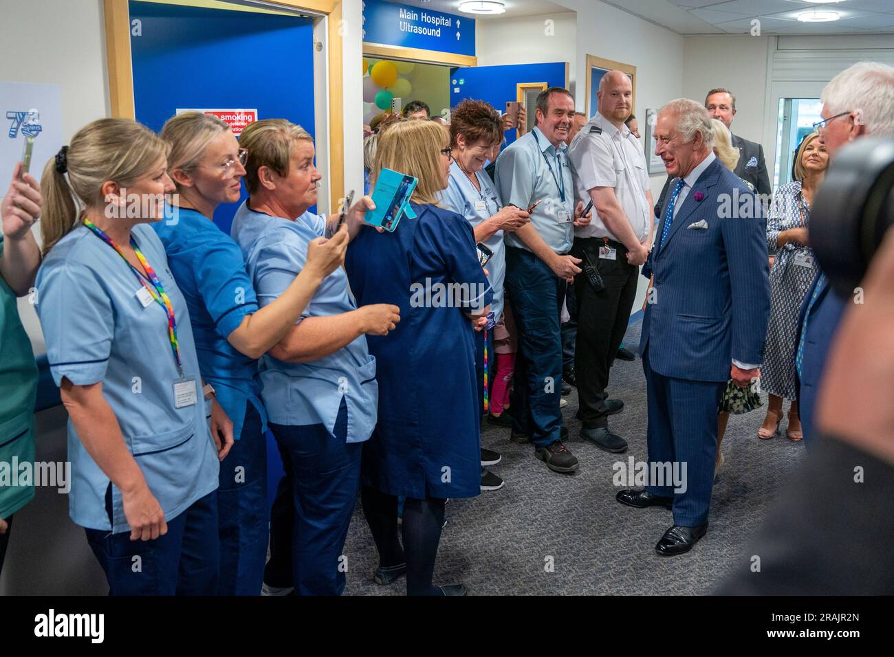 King Charles III meets staff during a visit to the Royal Infirmary of ...