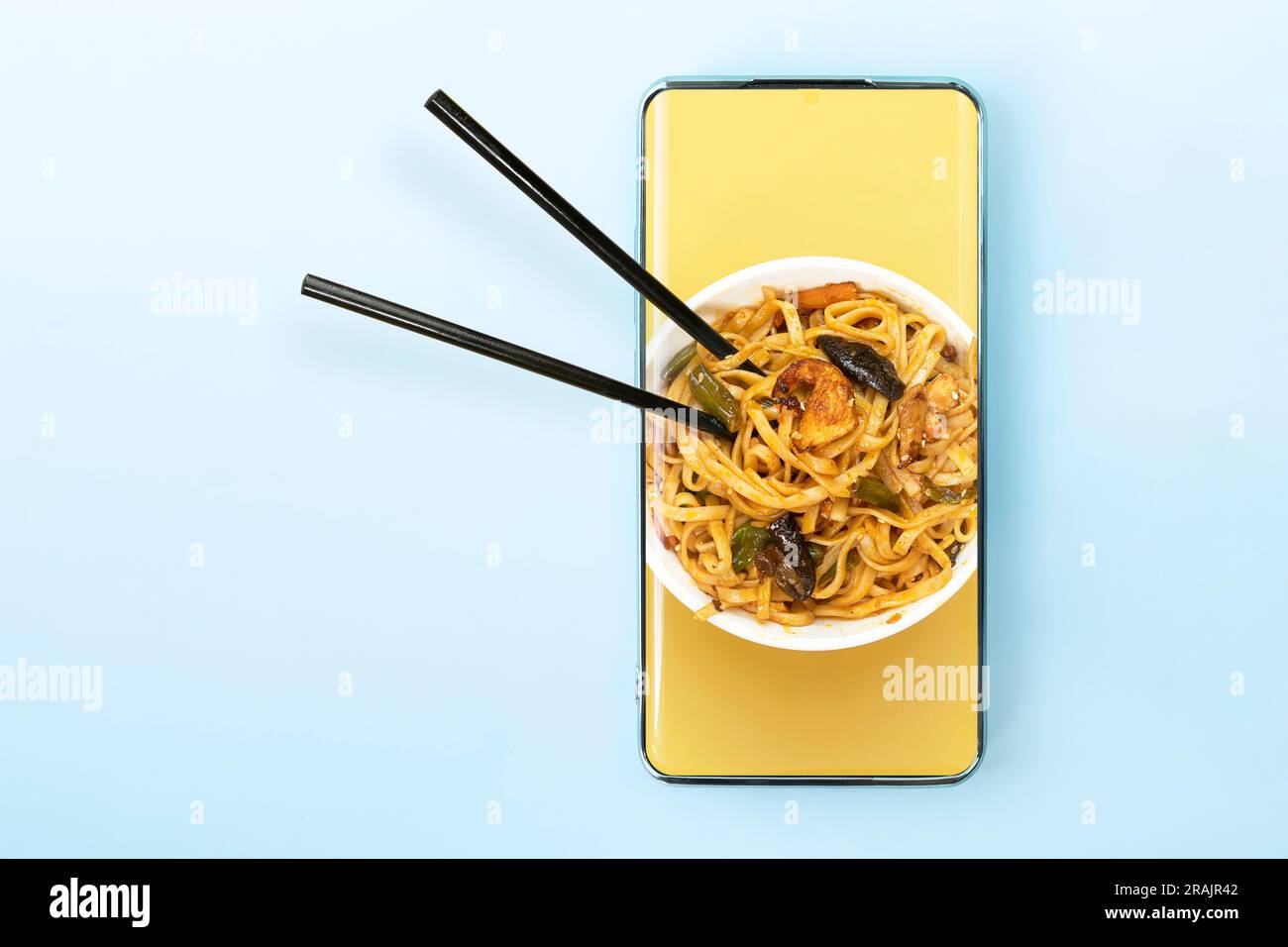 Concept of online food delivery with copy space. noodles with chicken ...