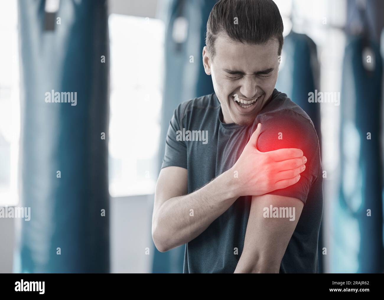 Hand, shoulder pain and the arm of a man in red highlight during a ...