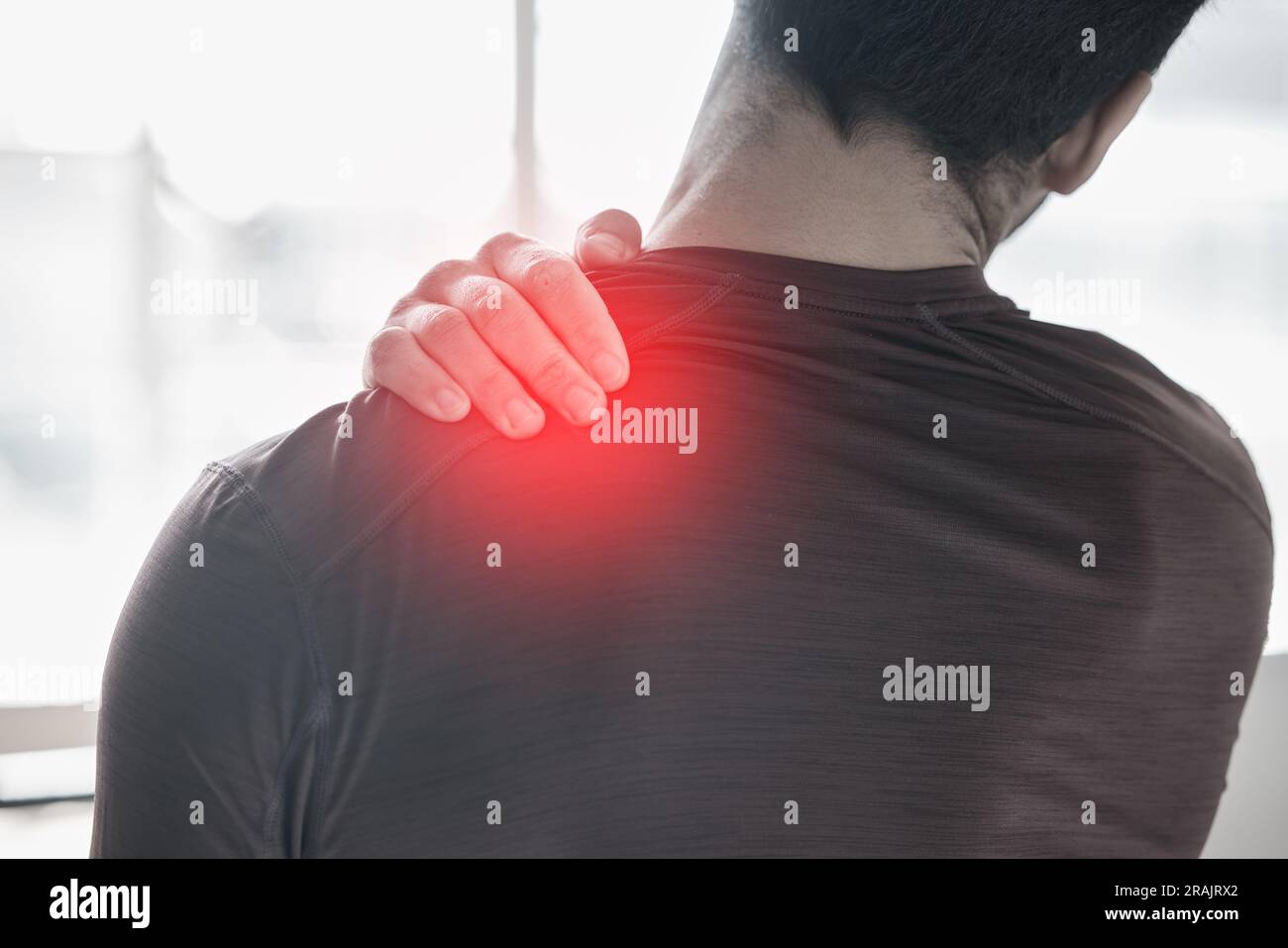 Hand, back pain and injury with the shoulder of a man in red highlight ...