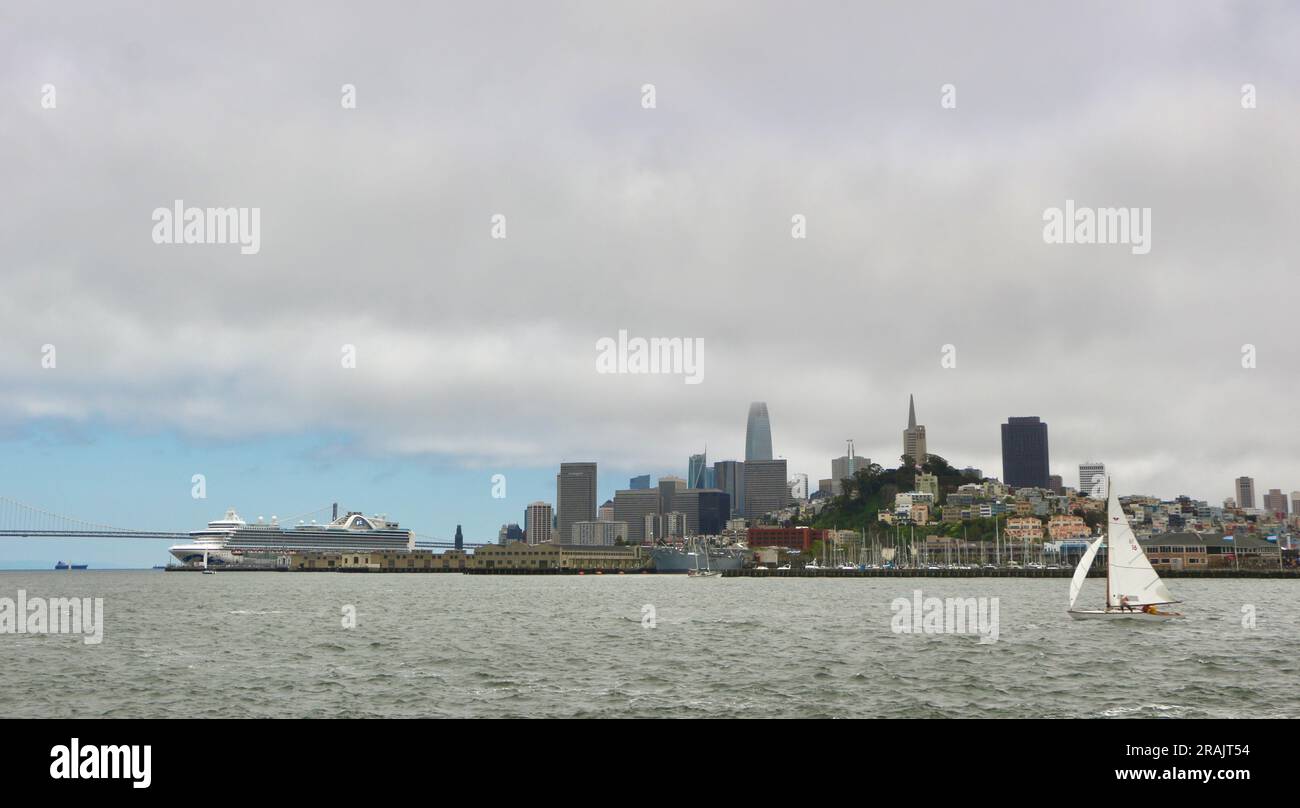 Ruby Princess cruise ship docked with low cloud clipping the top of ...