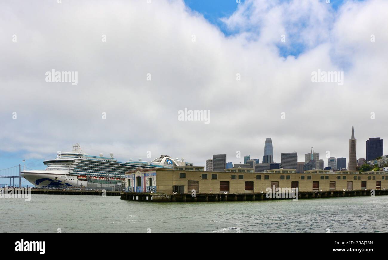 Ruby Princess cruise ship docked and Bay Bridge seen from a tour boat ...
