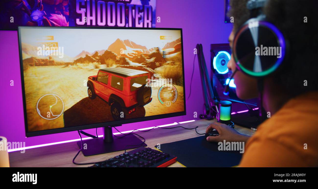 Young guy plays racing home hi-res stock photography and images - Alamy