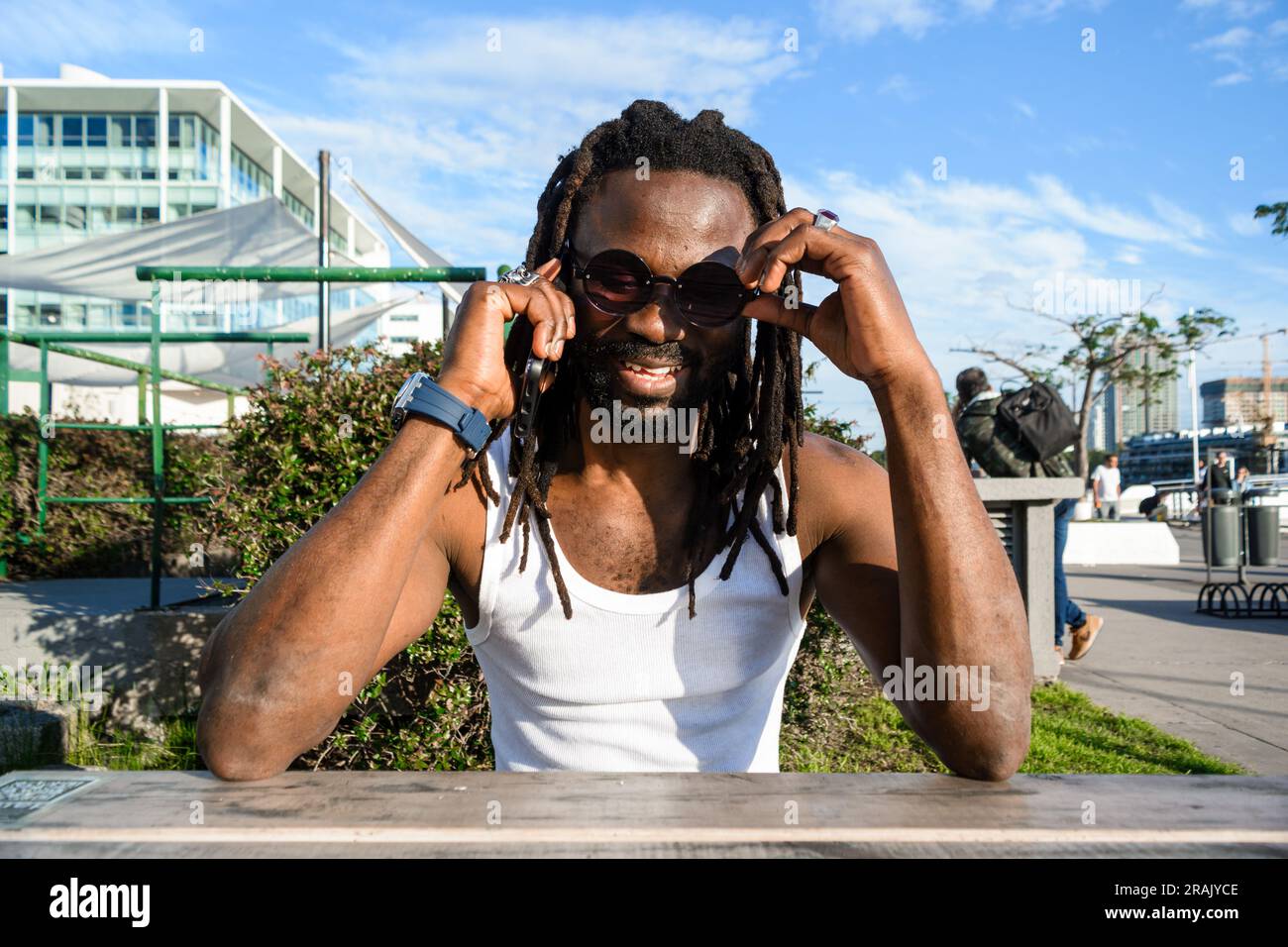 front view of young black man with dreadlocks of African ethnicity ...