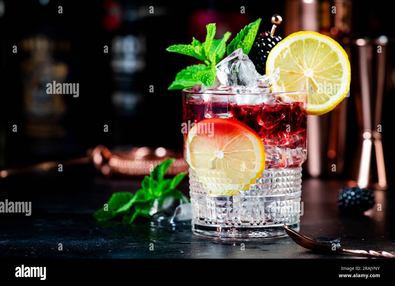 Bramble alcohol cocktail drink with dry gin, liqueur, syrup, lemon ...