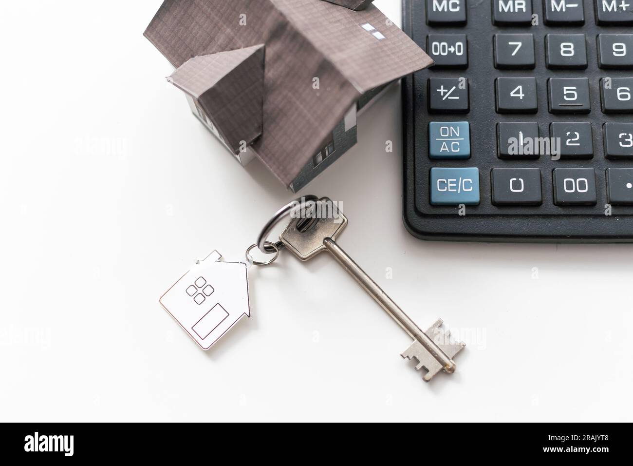 house key with new homeowner and calculator on office desk Stock Photo ...