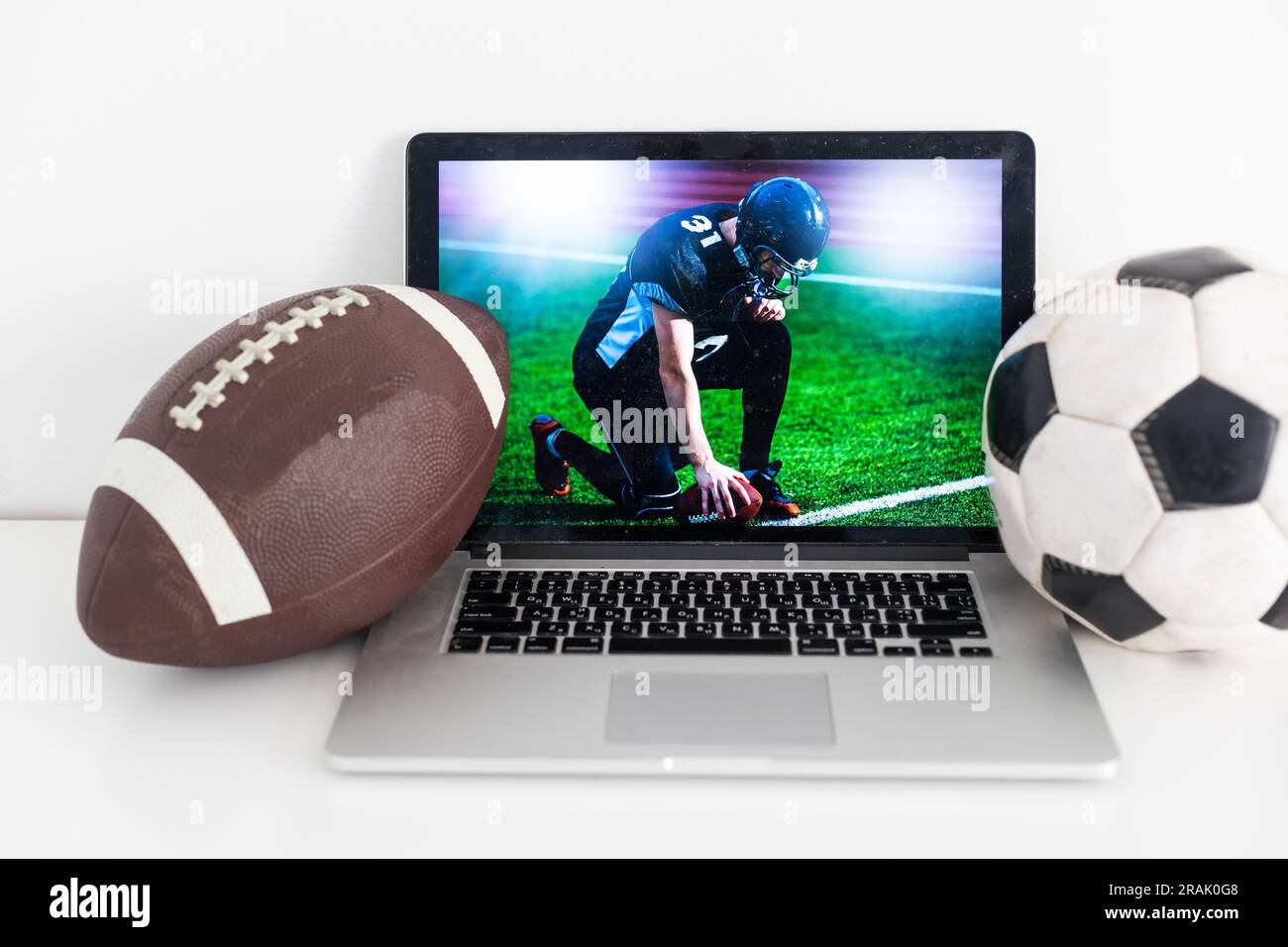In action. Young man american football player at stadium in motion on ...
