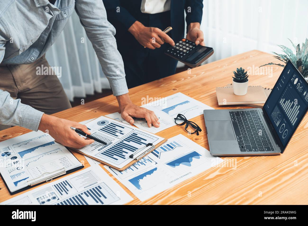 Busy analyst team in office analyzing financial data analysis for ...
