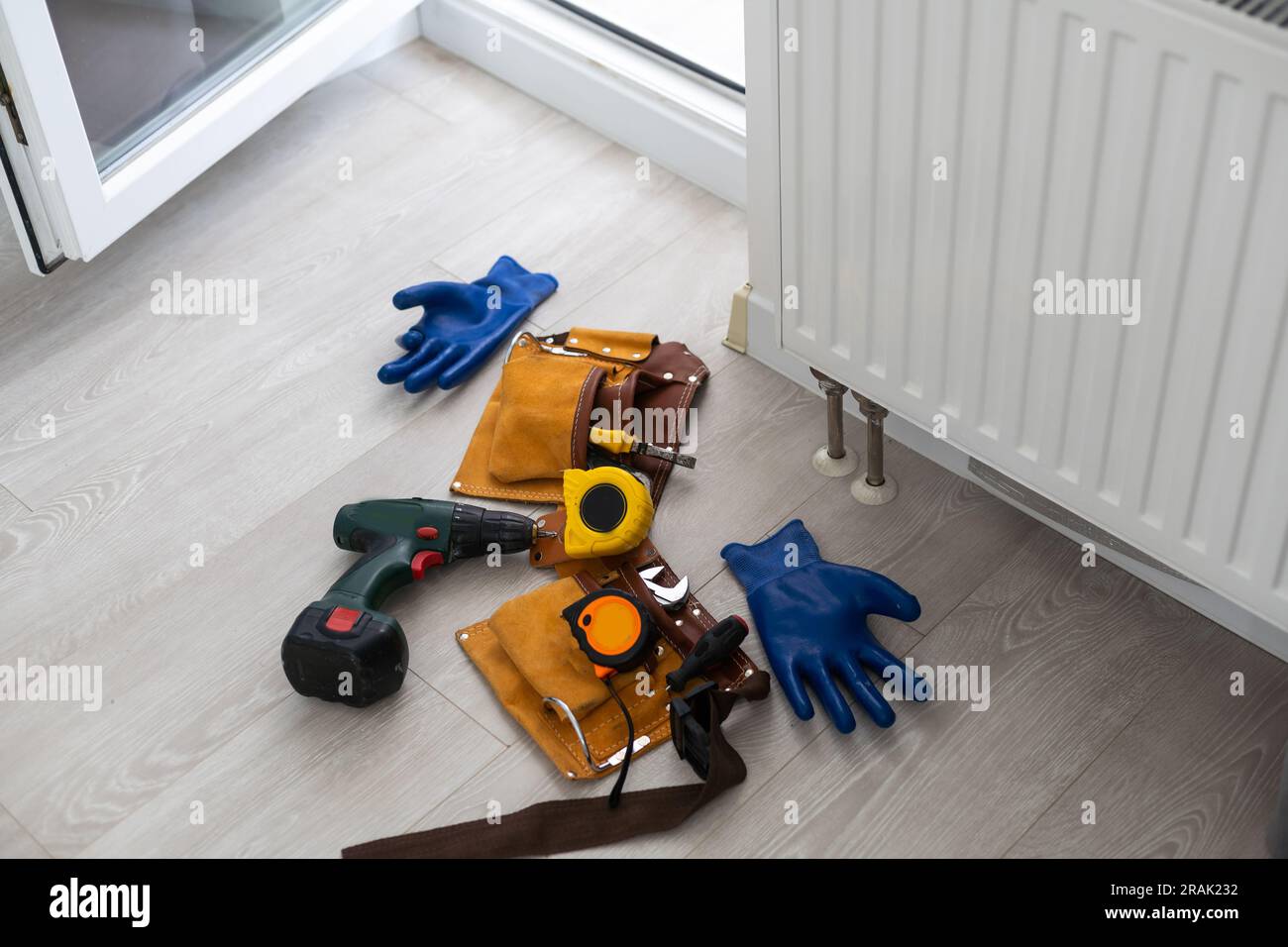 White hot water heater radiator built inside drywall indoors at home ...