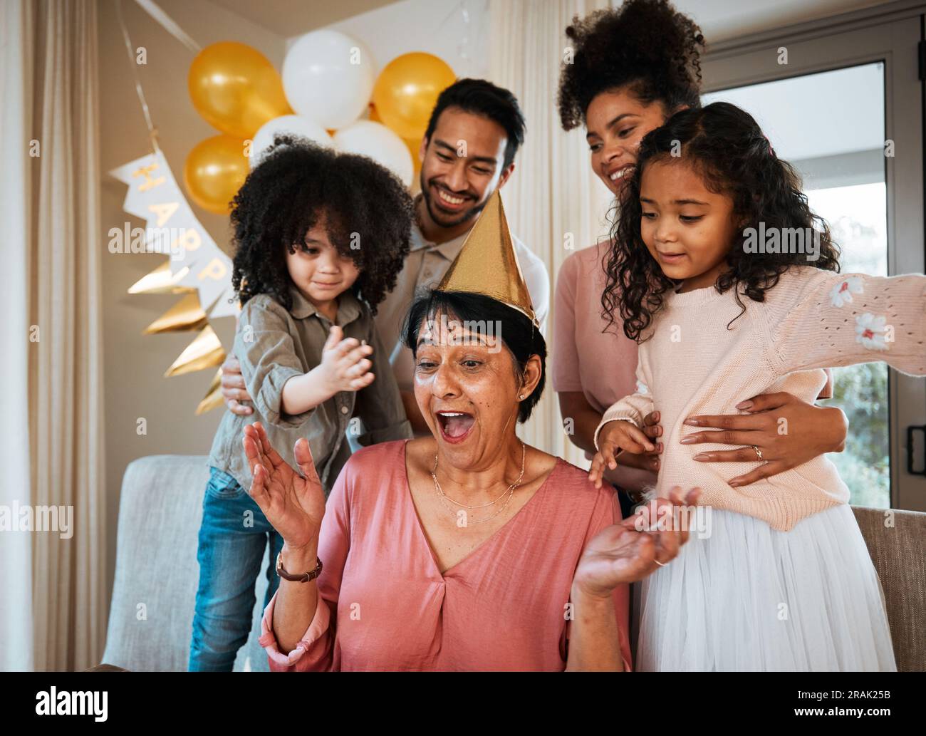 Birthday, surprise and children with excited grandmother at party for ...