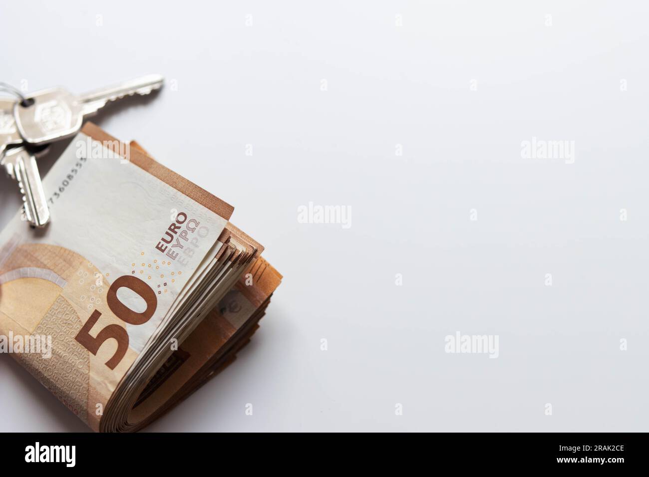 isolated on white background euro banknotes of 50 folded and next to ...