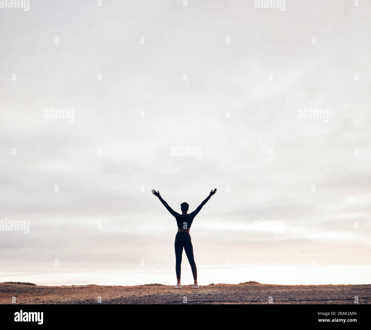 Fitness, hands in air and back of woman with achievement, success and ...