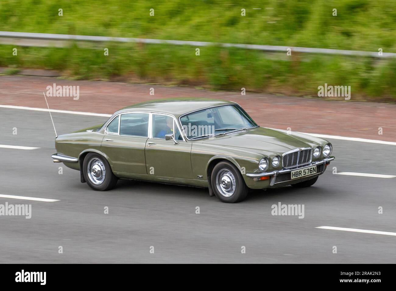 1974 70s seventies Green Jaguar 4.2 XJ6 L Auto; travelling at speed on ...