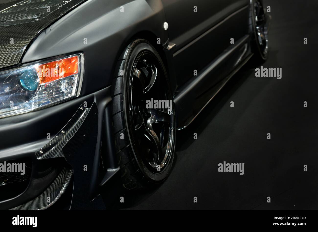 Front headlights of black modify car on black background Stock Photo ...
