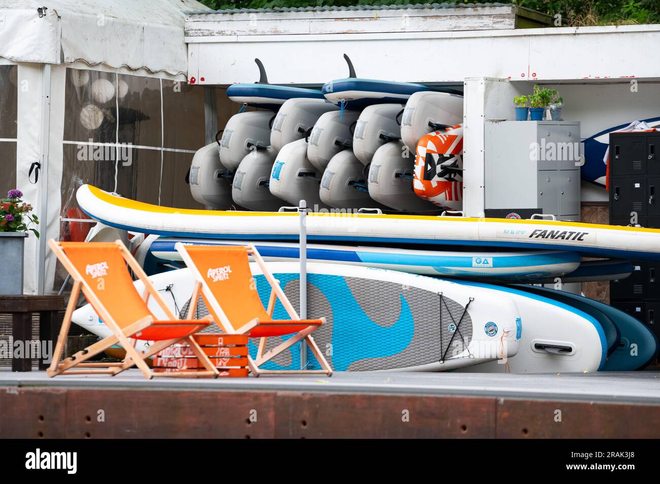 Hamburg, Germany. 04th July, 2023. Two deck chairs and numerous SUP ...