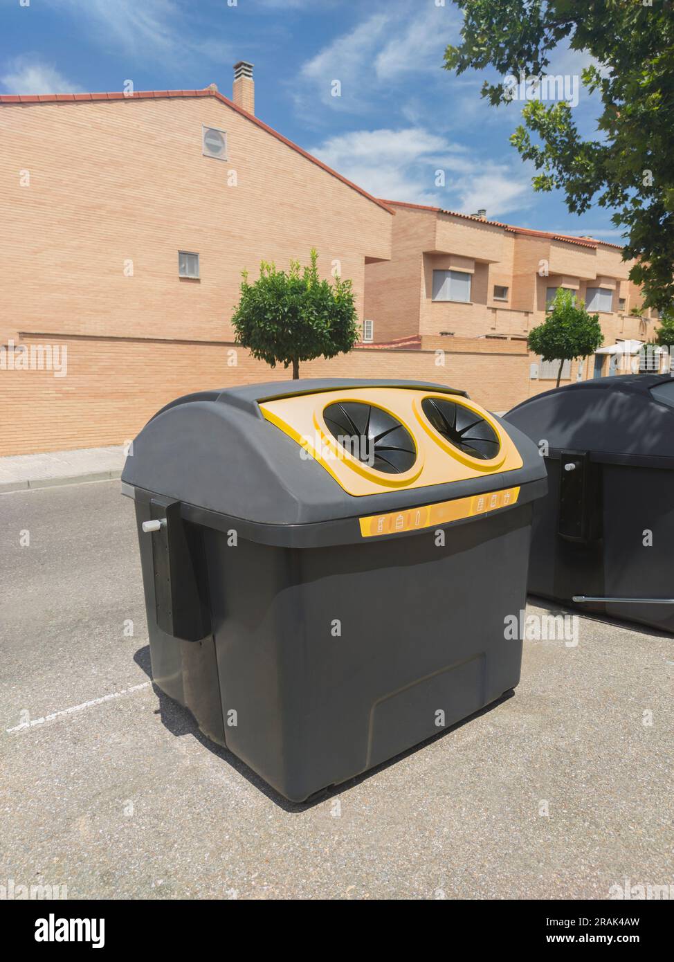 New yellow dumpster placed at residential area. Urban background Stock ...