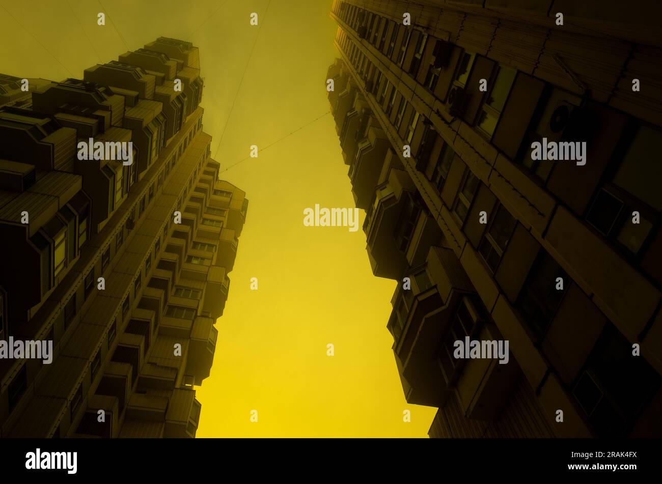 Tall residential buildings in the form of a tower, immersed in a misty ...