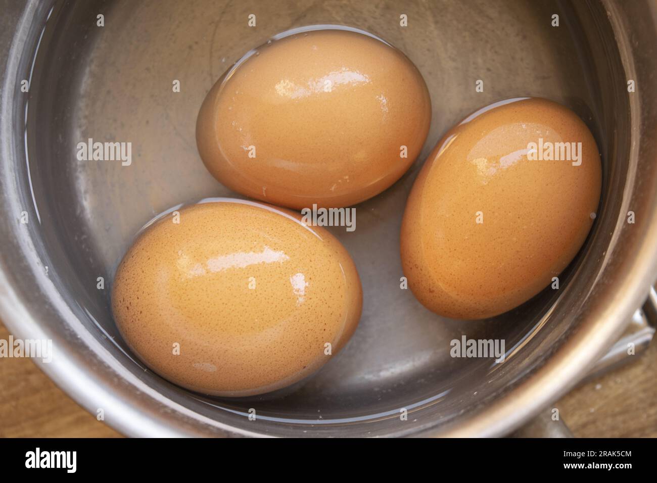 preparation of hard-boiled eggs in a pot with boiling water Stock Photo ...