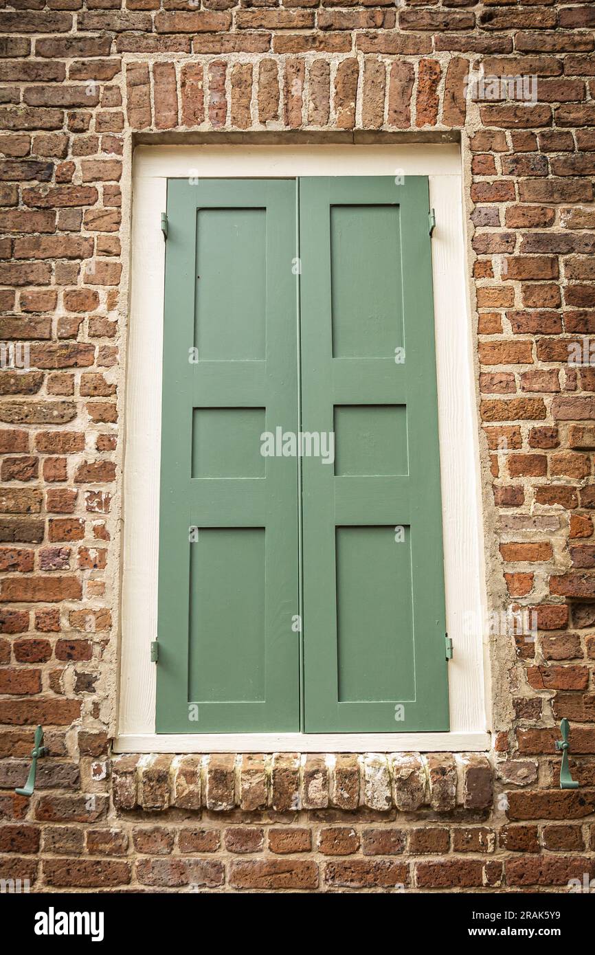 Close up of the color windows of a colonial era home in Charleston ...