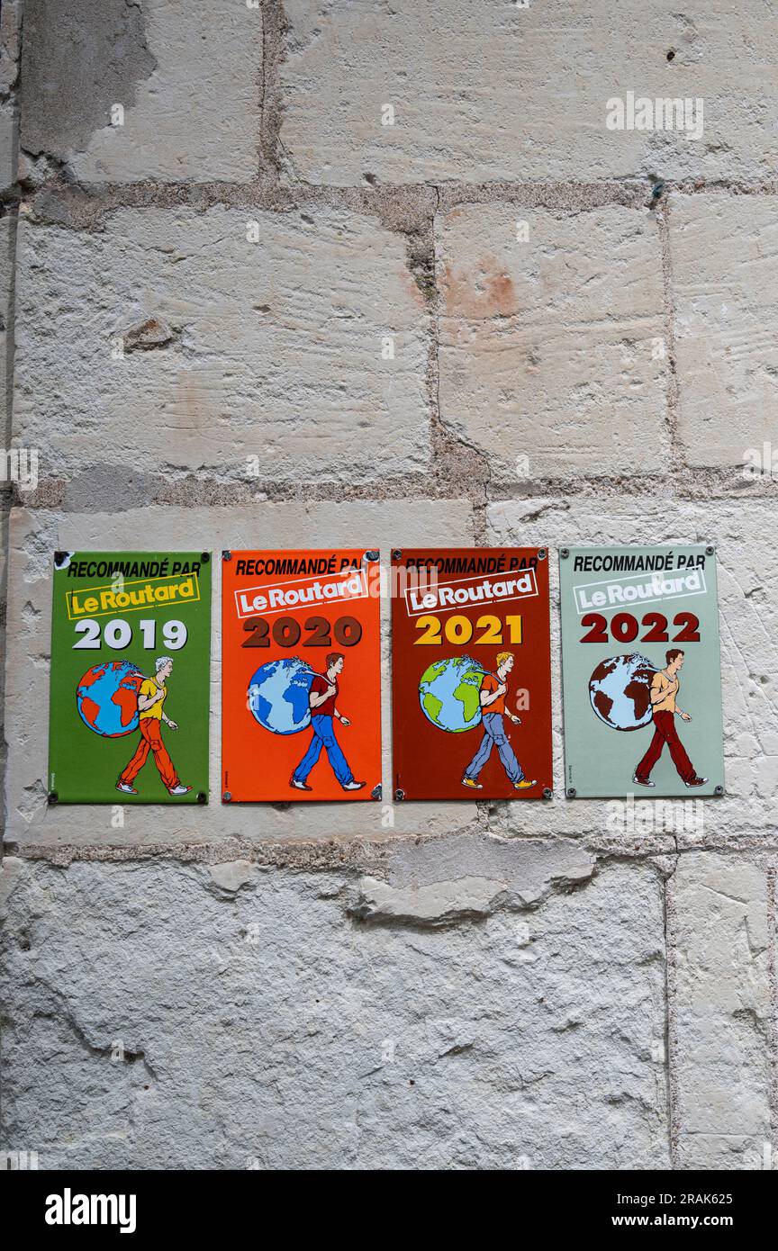 Le Routard travel guide and restaurant guide signs outside a restaurant ...