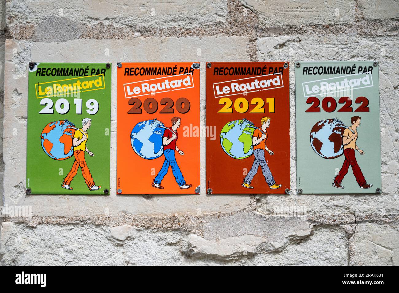 Le Routard travel guide and restaurant guide signs outside a restaurant ...