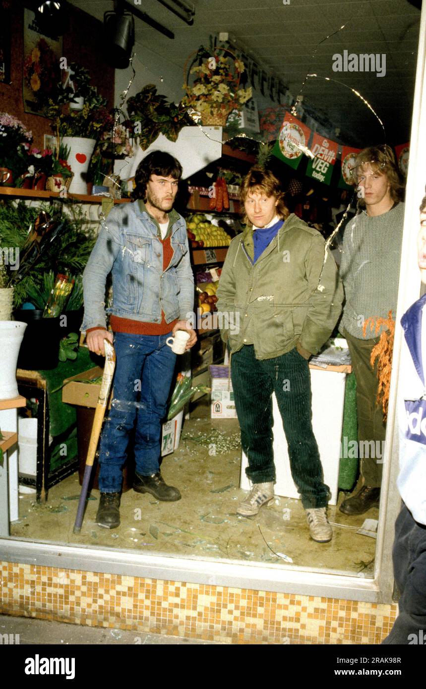 Men guarding shop premises with hockey stick in Wolverhampton after the ...