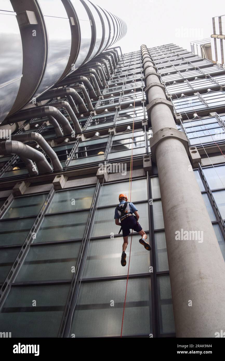 London, UK. 4th July 2023. A participant abseils down the side of Lloyd ...