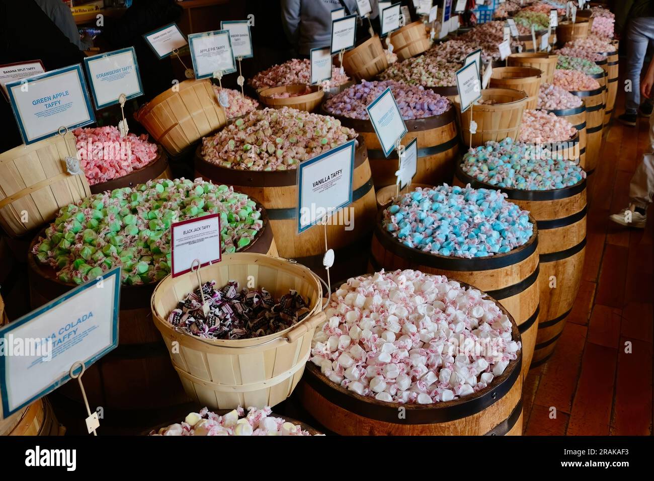 Interior of The Candy Baron confectionary shop with barrels of sweets ...