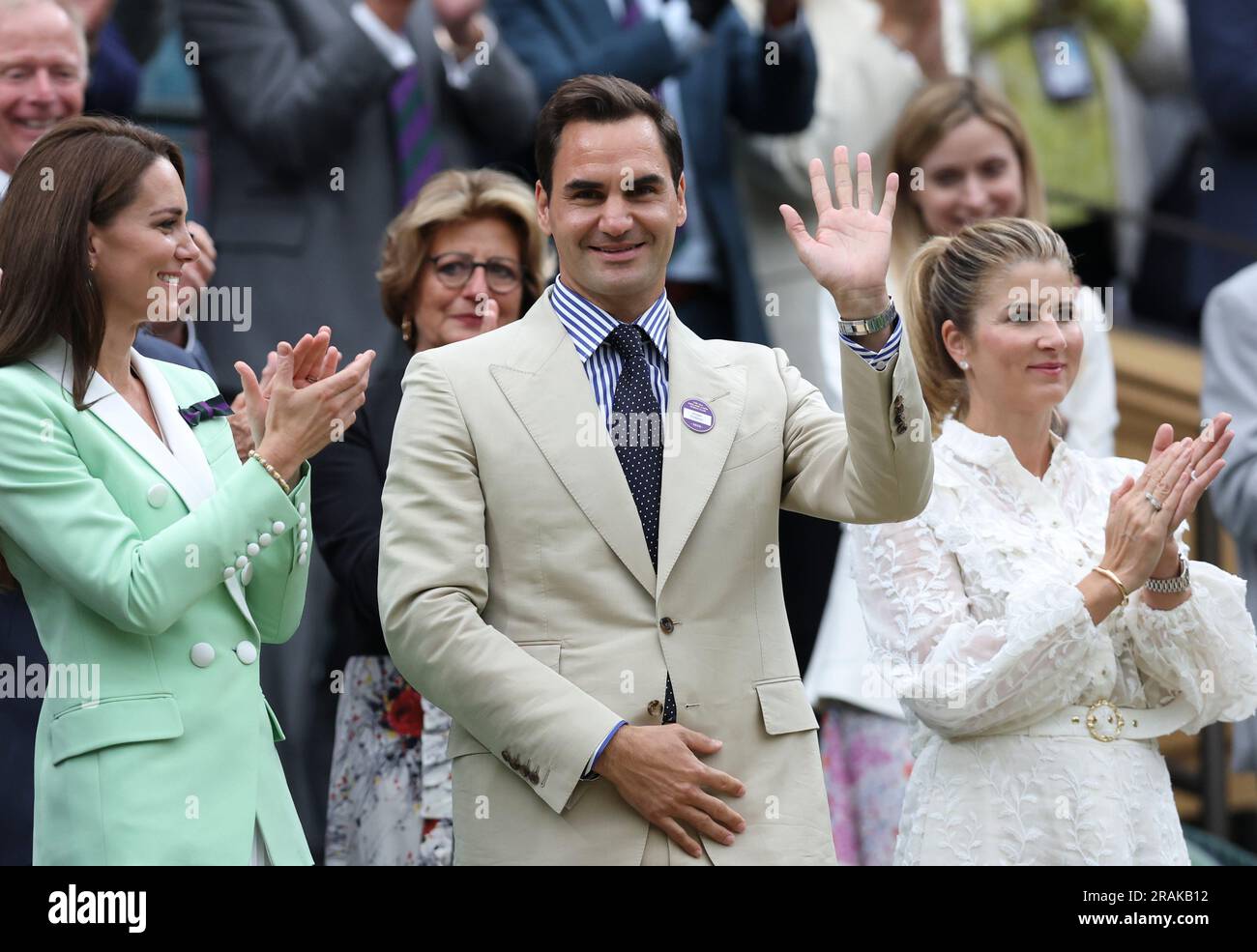 London, Britain. 4th July, 2023. Roger Federer (front C) stands with ...