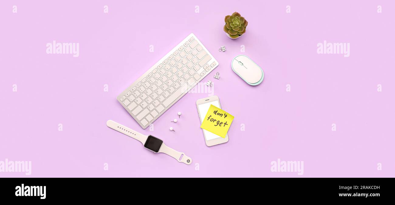 Sticky note with text DON'T FORGET and modern gadgets on lilac ...