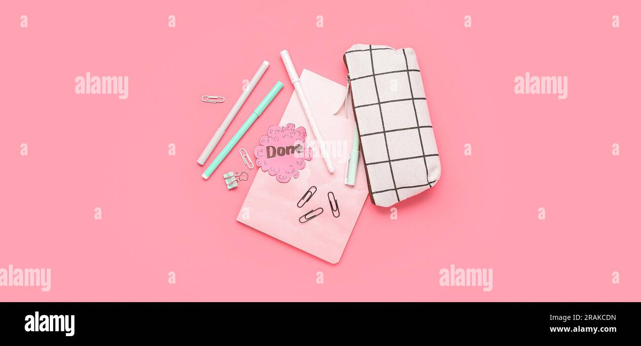 Sticky note with word DONE and stationery on pink background Stock ...