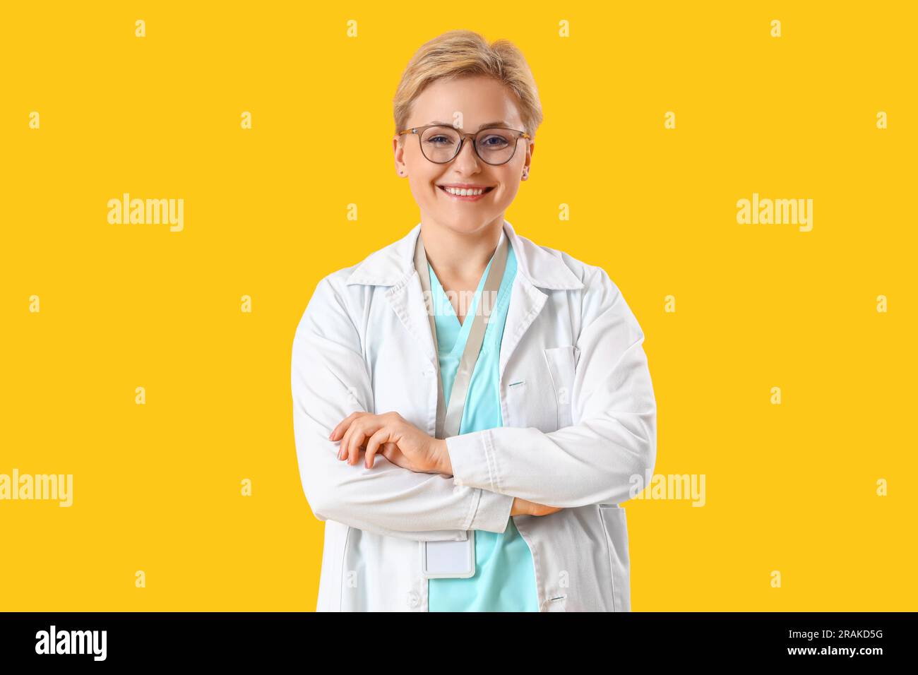 Female medical intern on yellow background Stock Photo - Alamy