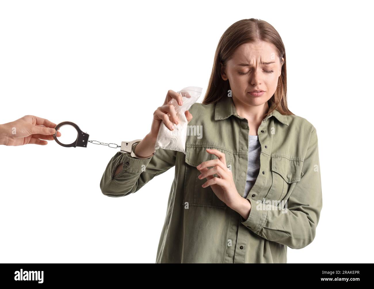 Young female junkie with drugs and handcuffs on white background Stock ...