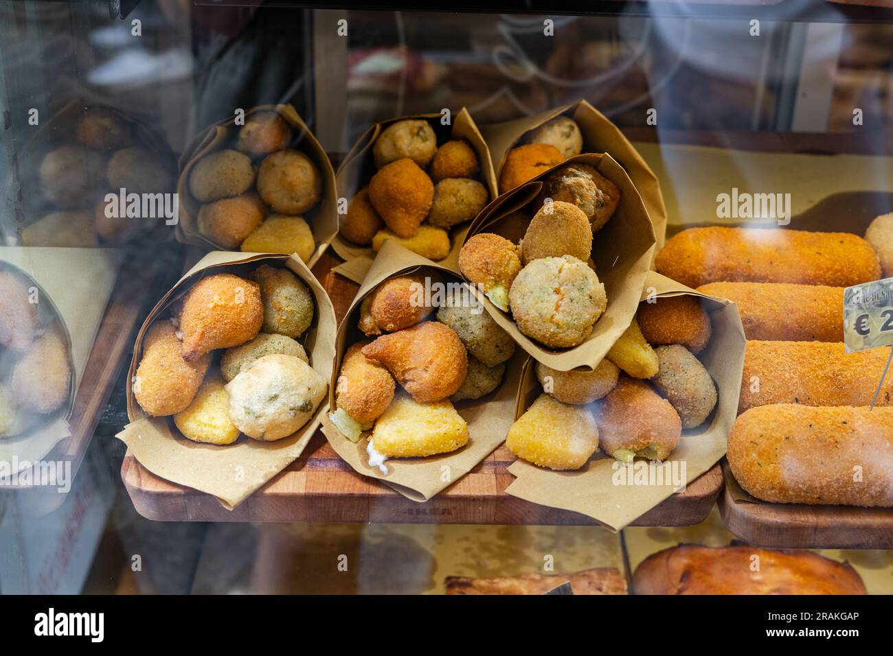 Deep fried snacks (fritto misto) in a bag sold in Napels, Italy Stock ...