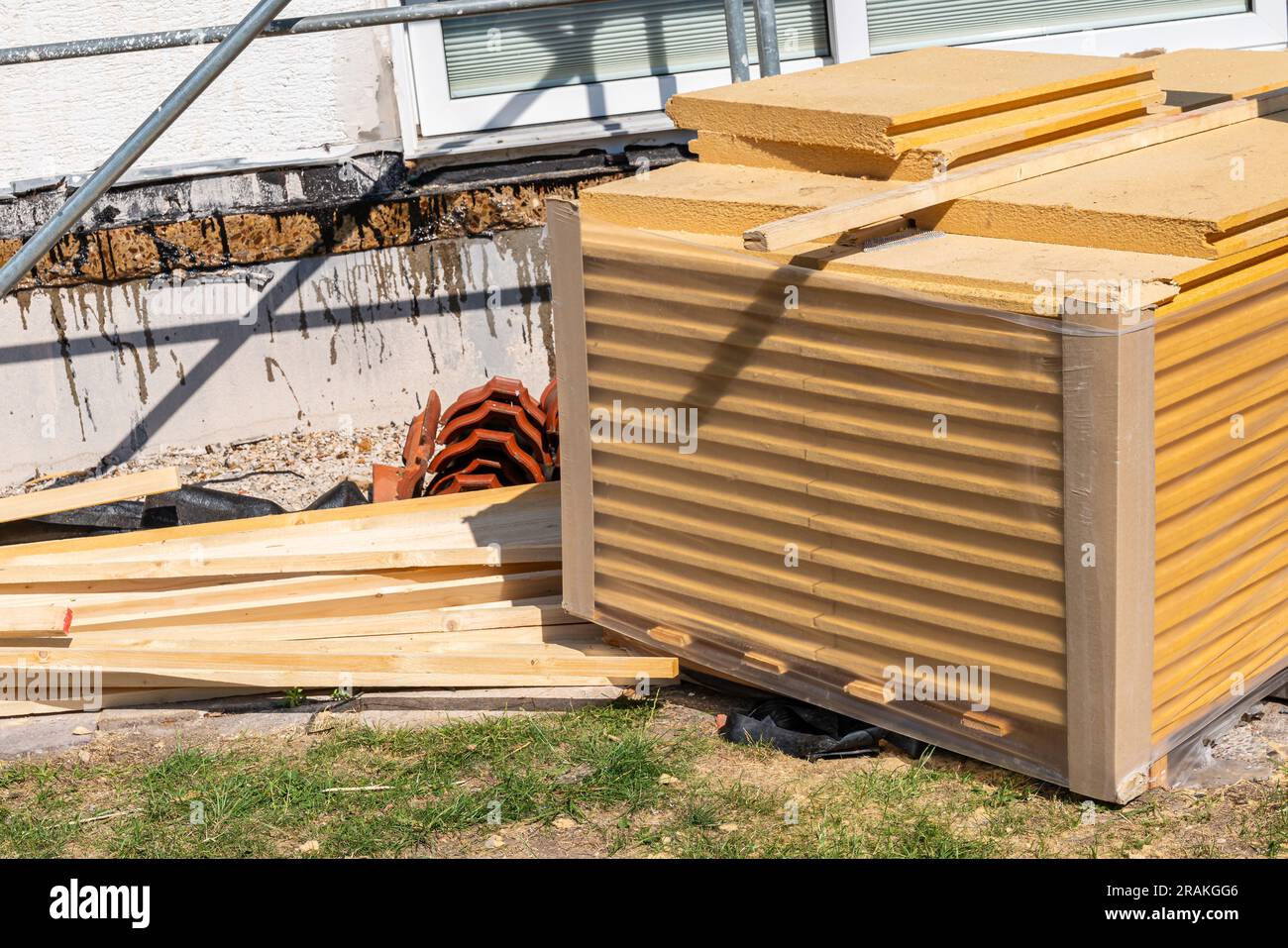 Orange foam insulation boards in a container at a construction site ...