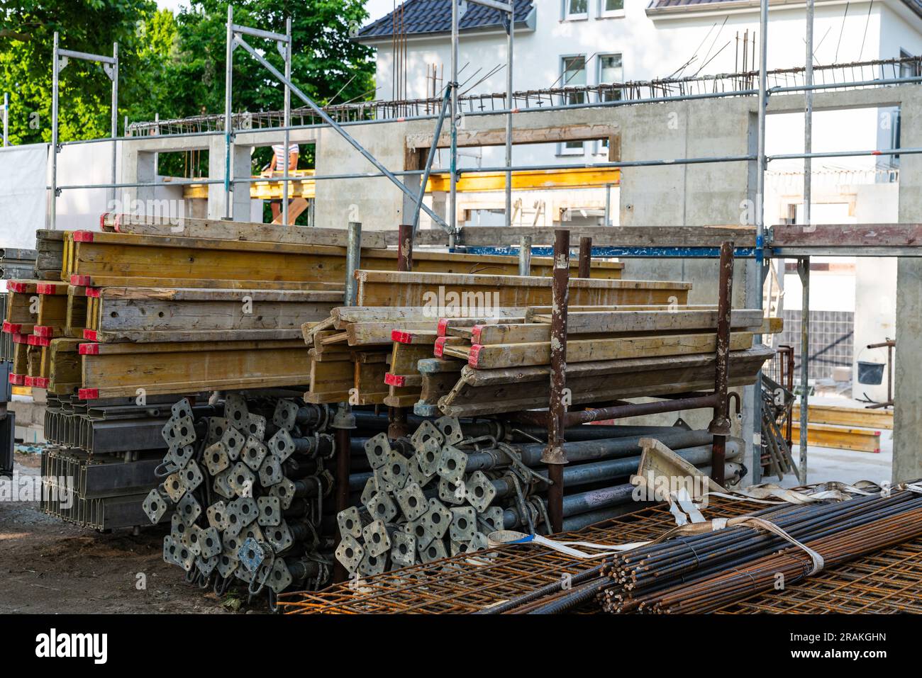 Wooden and metal beams stacked together with reinforcement lie against ...