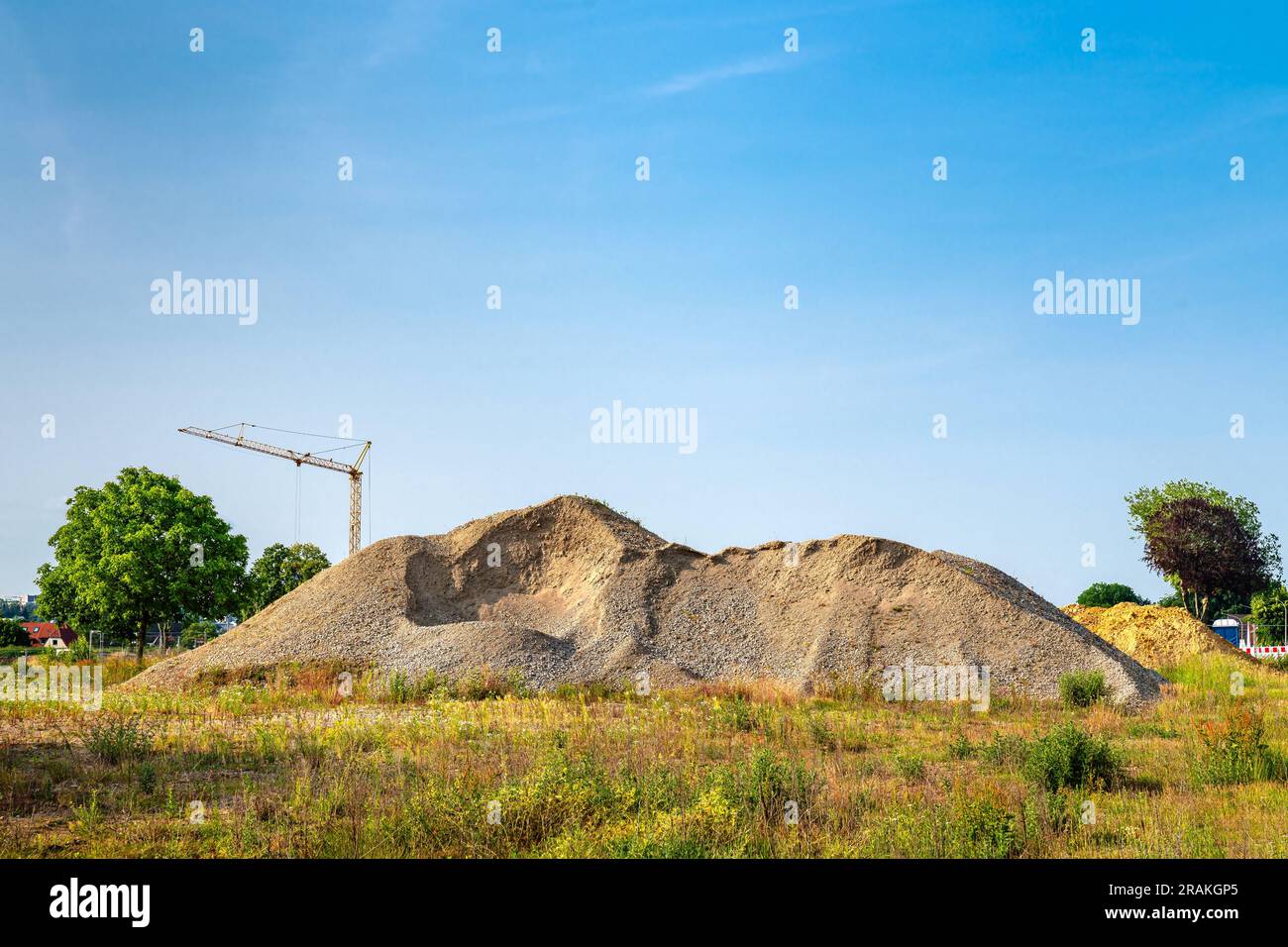 A large pile of rubble at a construction site under a blue sky Stock ...