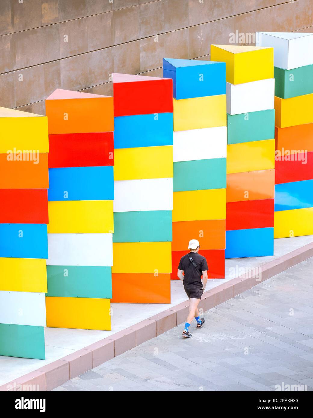 Man walking past the Slow Revolution art installation by artist Liz ...