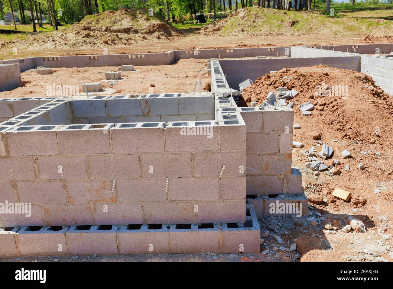Masonry building foundation of walls in house with dredged soil around ...