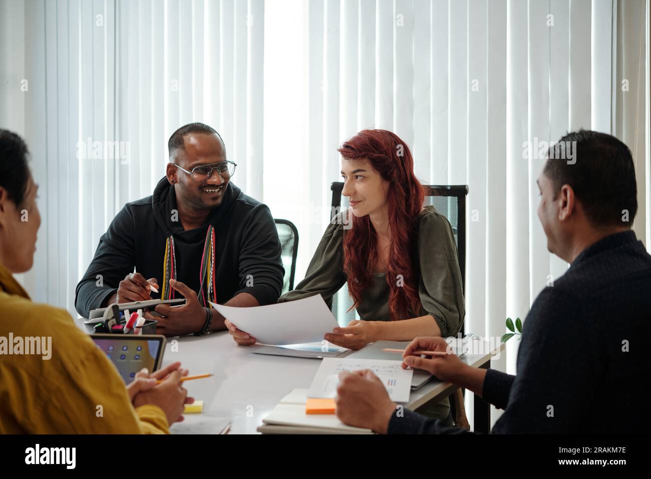 Marketing team discussing product development at meeting Stock Photo ...