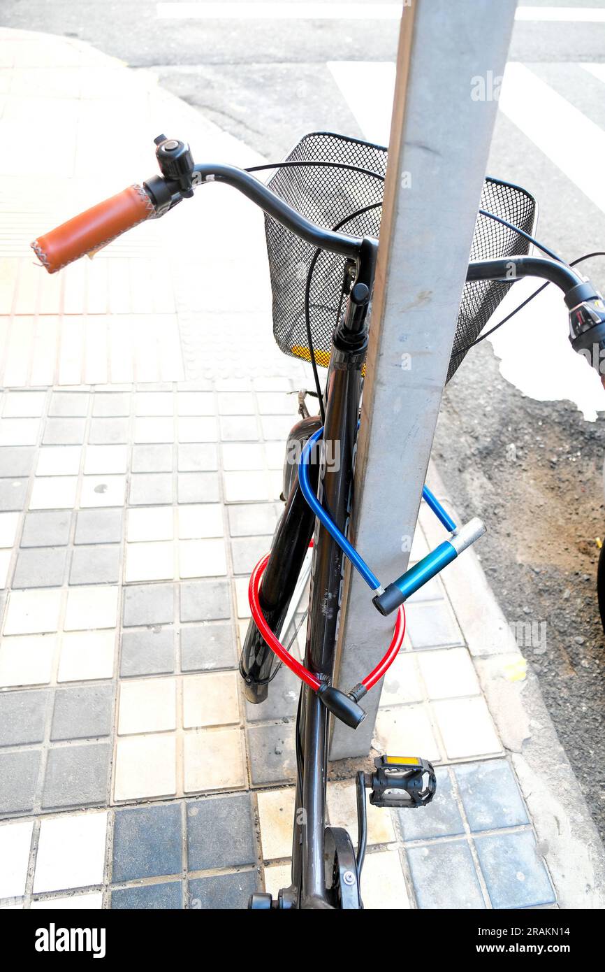 Bicycle theft prevented with double bicycle locks Stock Photo - Alamy