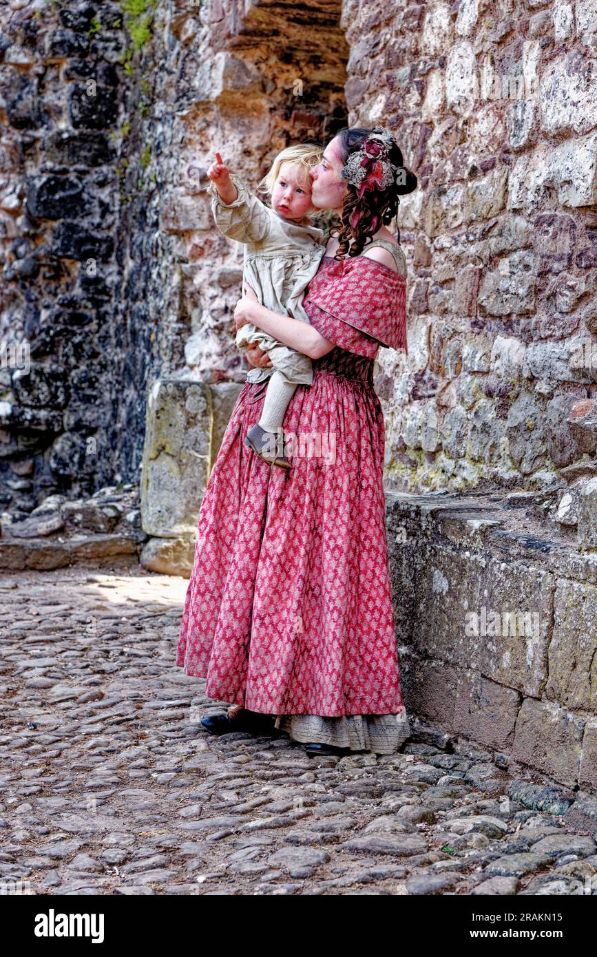 Mother and kid wearing pseudo-Victorian costumes at Raglan Castle ...