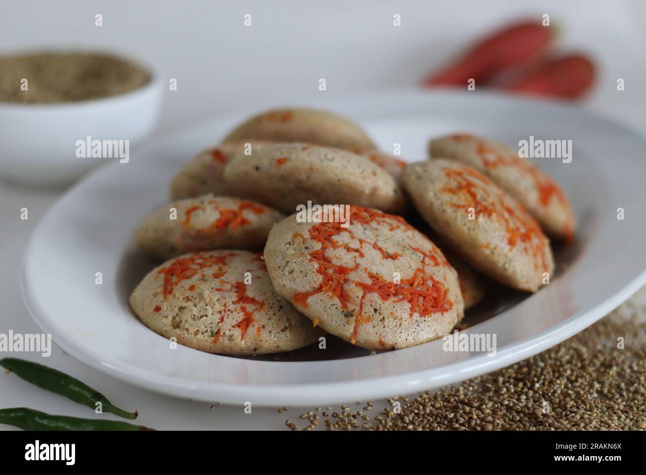 Carrot bajra idly. Steamed savory rice cake made by a batter of ...