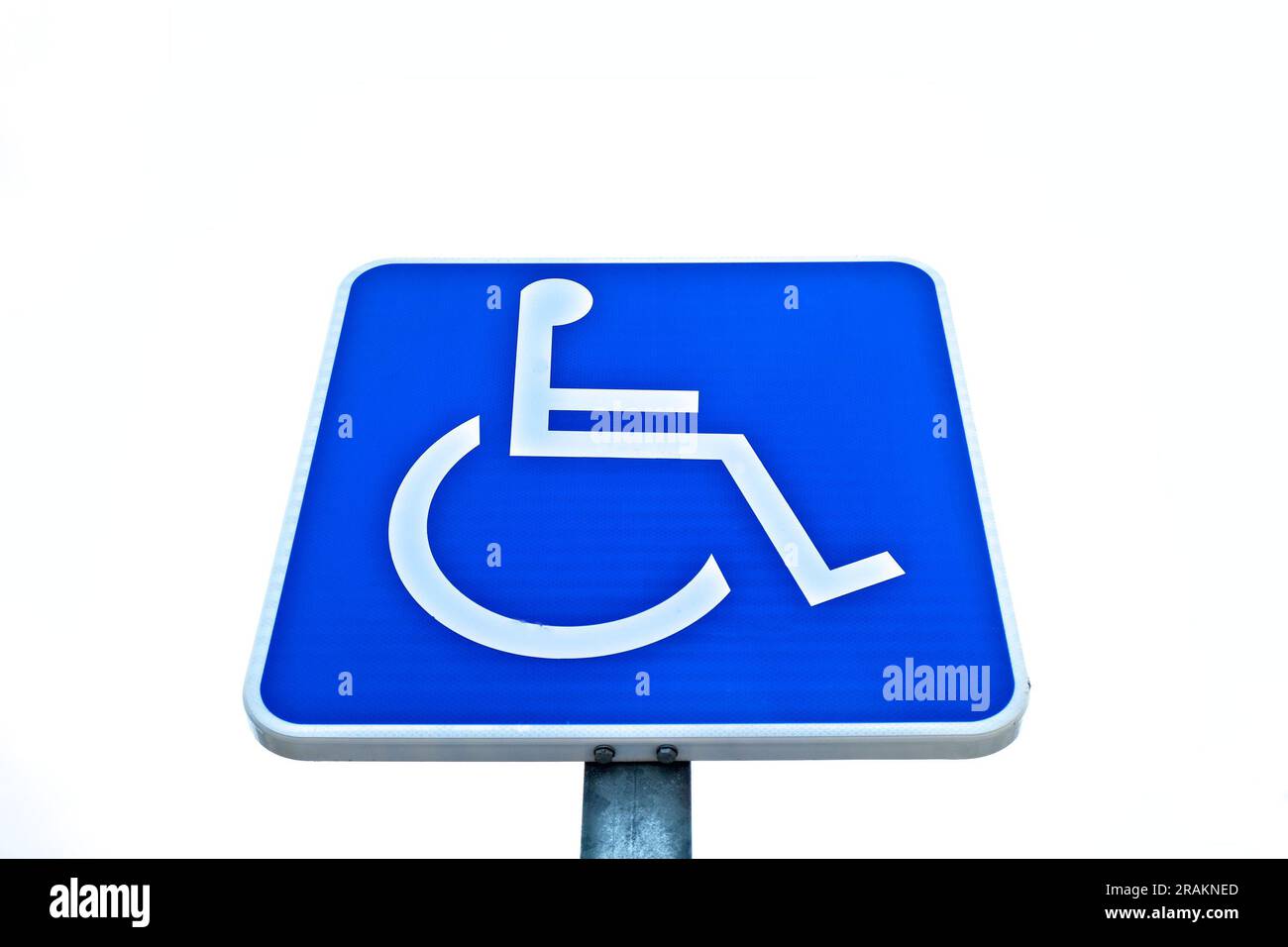 International Symbol of Access (ISA) sign, low angle view against pale ...